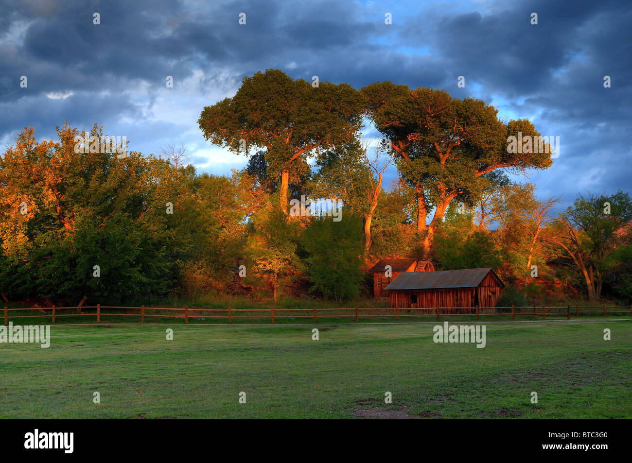 Sunset storm over old farm house Stock Photo - Alamy