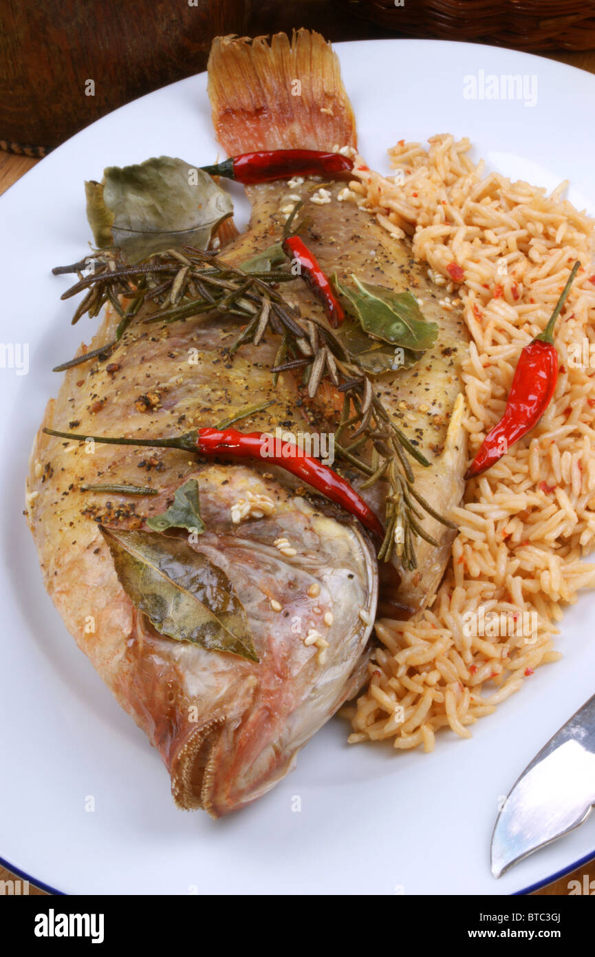 organic sea bream from greece with rice Stock Photo - Alamy