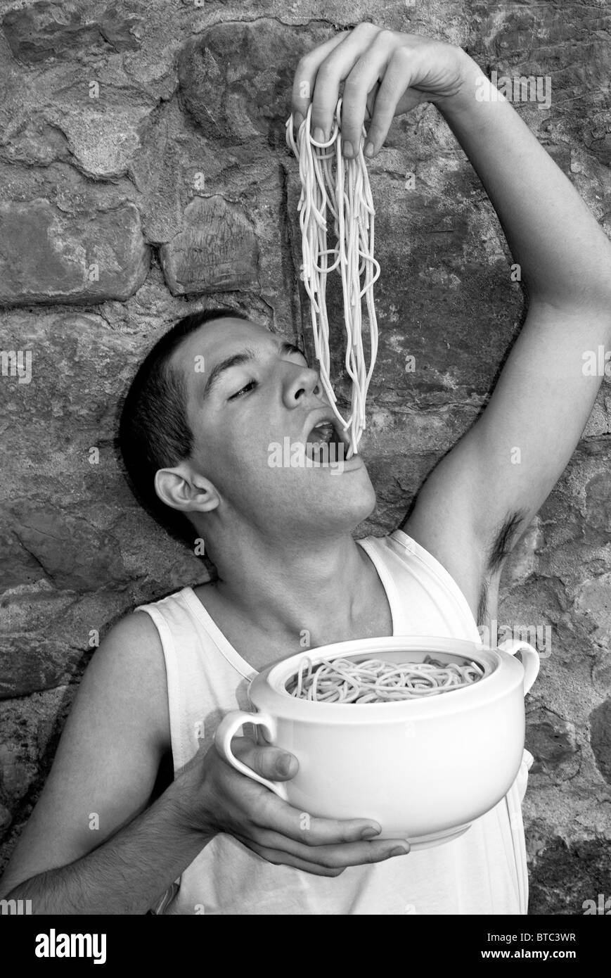 Young boy eating spaghetti, Italy, M.R Stock Photo - Alamy