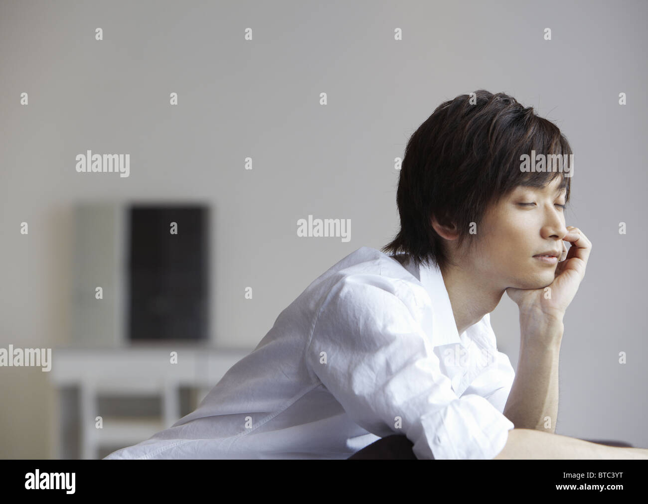 Resting chin on upper body hi-res stock photography and images - Alamy