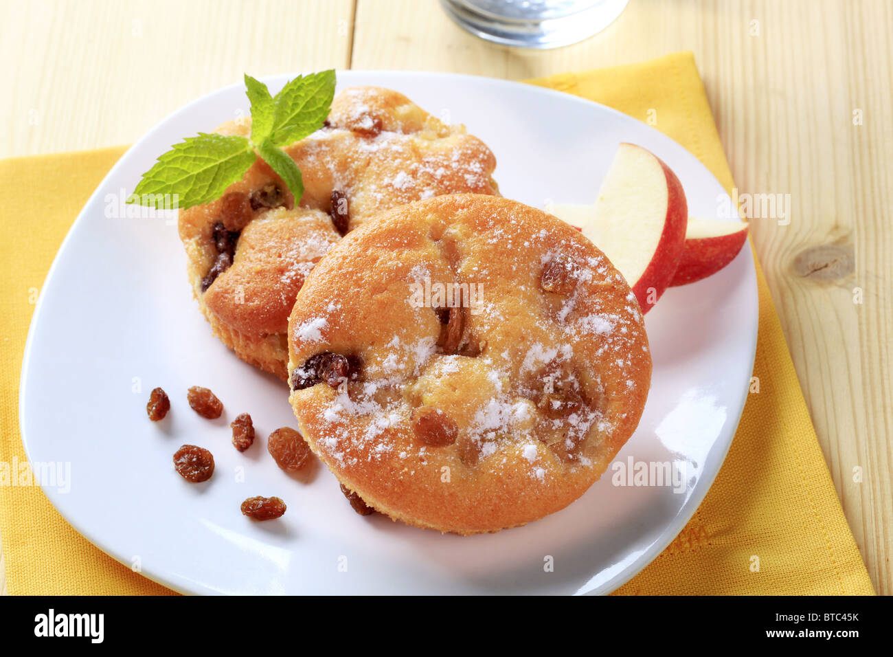 Small sponge cakes with raisins Stock Photo - Alamy
