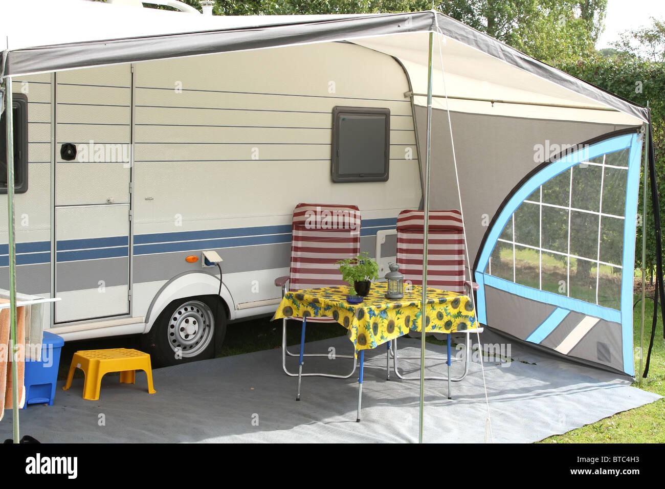 Touring caravan with a veranda awning Stock Photo - Alamy