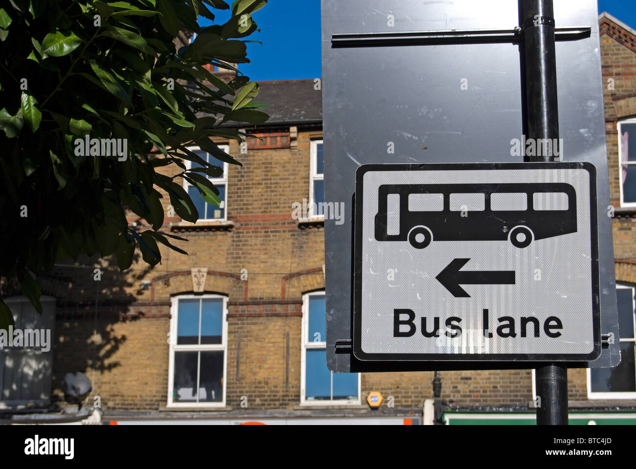 british traffic sign on the approach to a junction indicating a bus ...