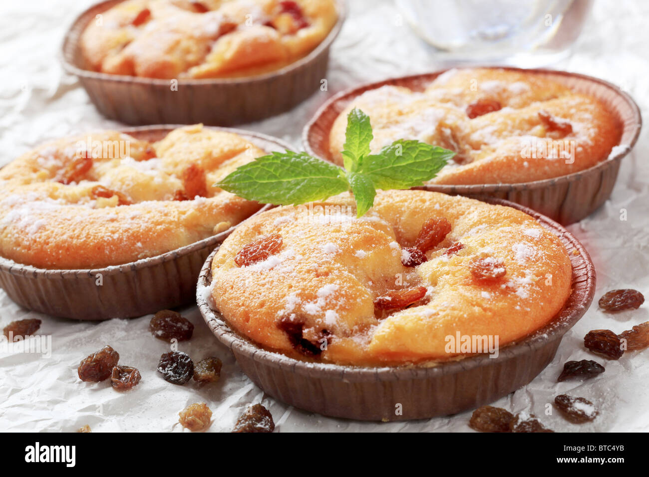Small sponge cakes with raisins Stock Photo - Alamy