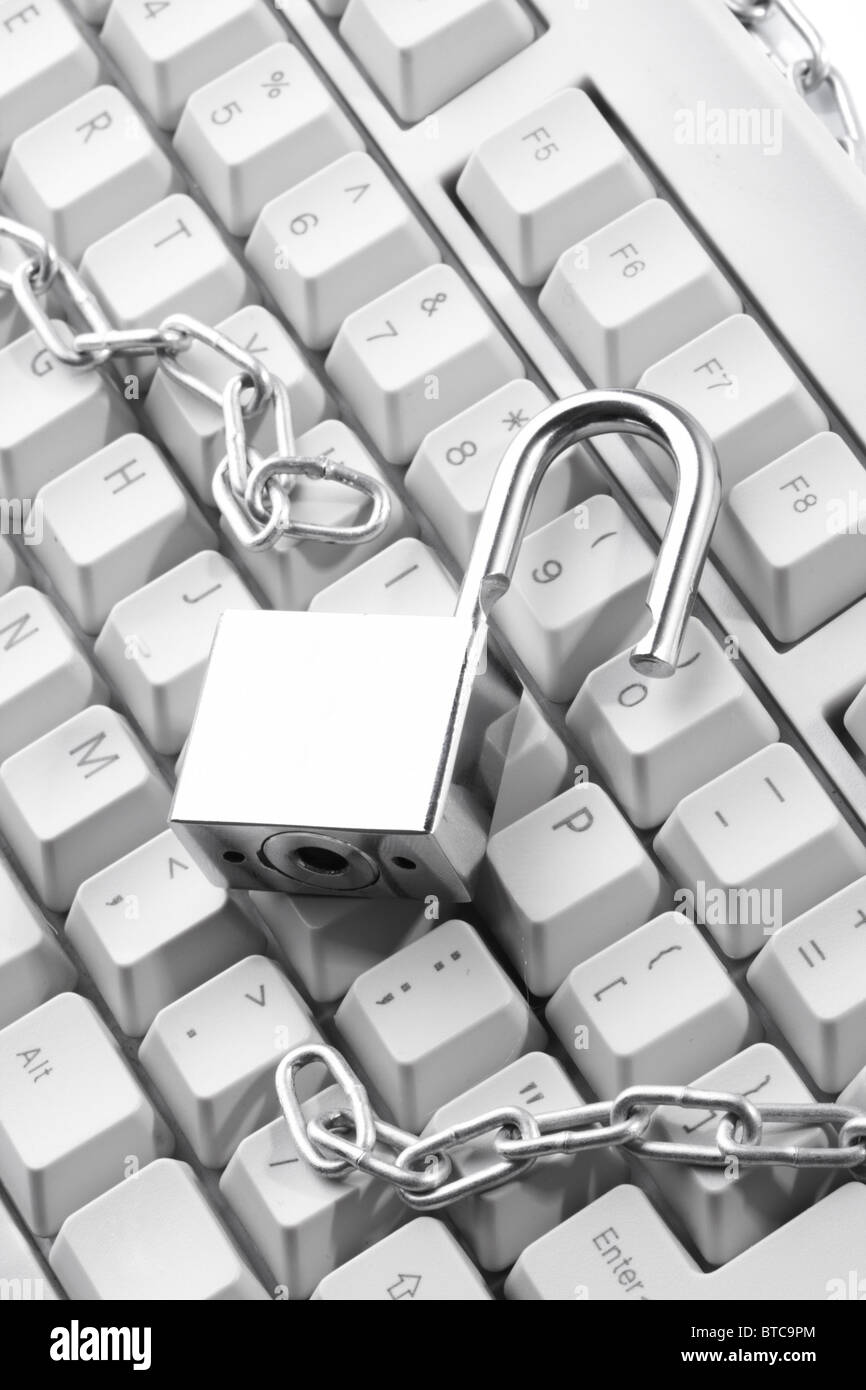Computer keyboard secured with chain and padlock Stock Photo - Alamy