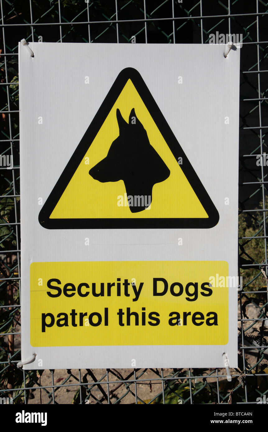 A warning sign: "Security dogs patrol this area". At the 2012 Olympic ...