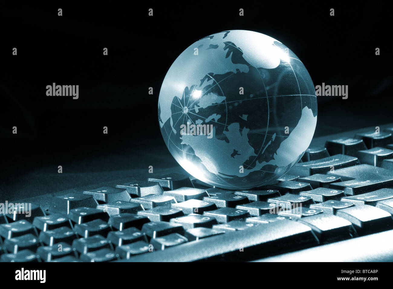 Globe and keyboard Stock Photo - Alamy