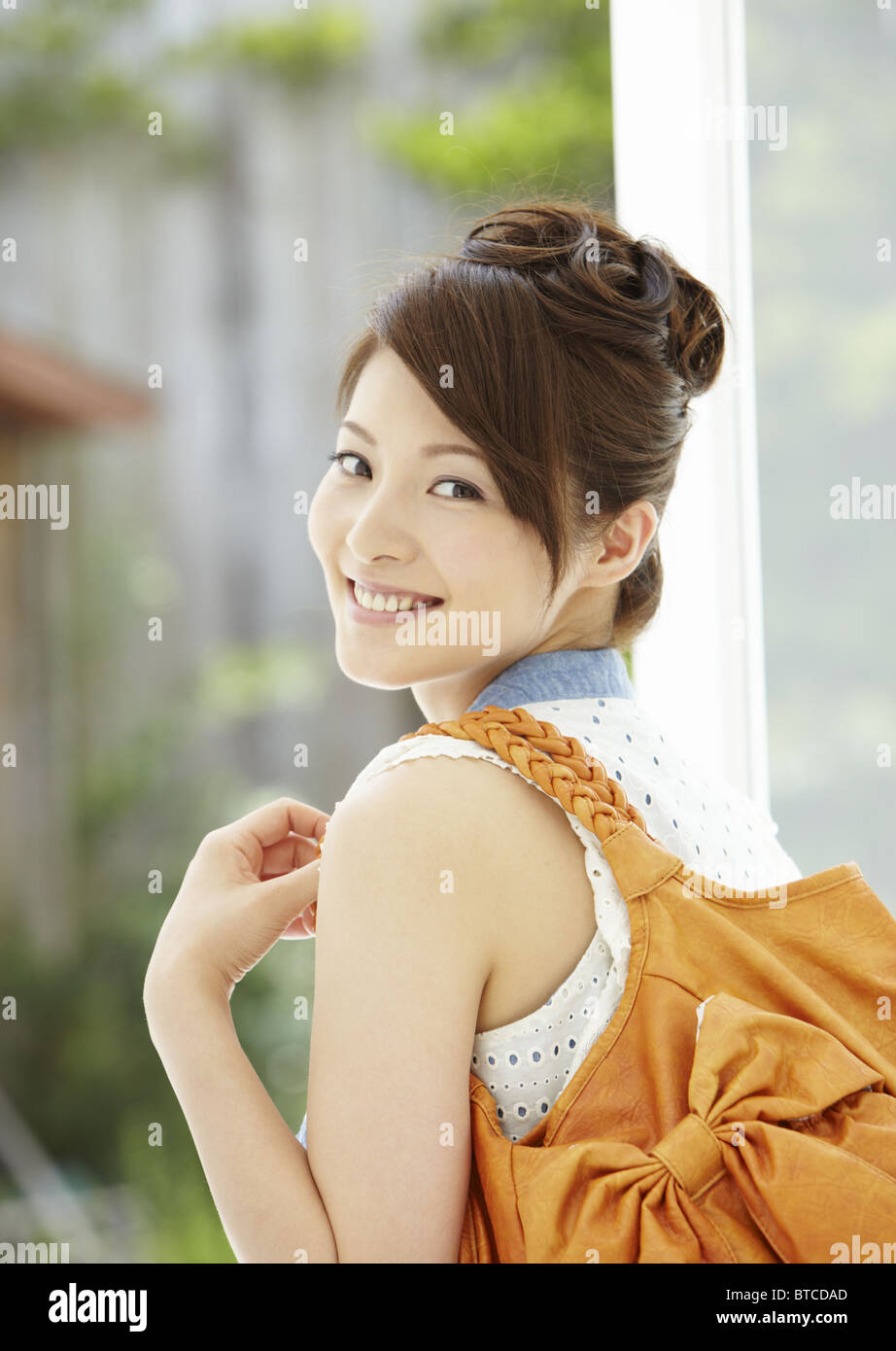 Woman going out Stock Photo - Alamy