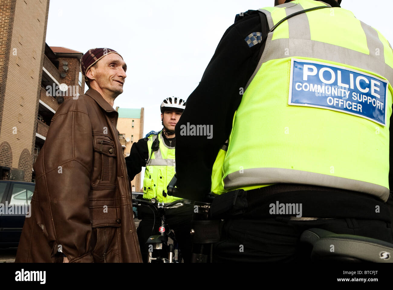Police Community Support Officers chat with a local resident on a ...