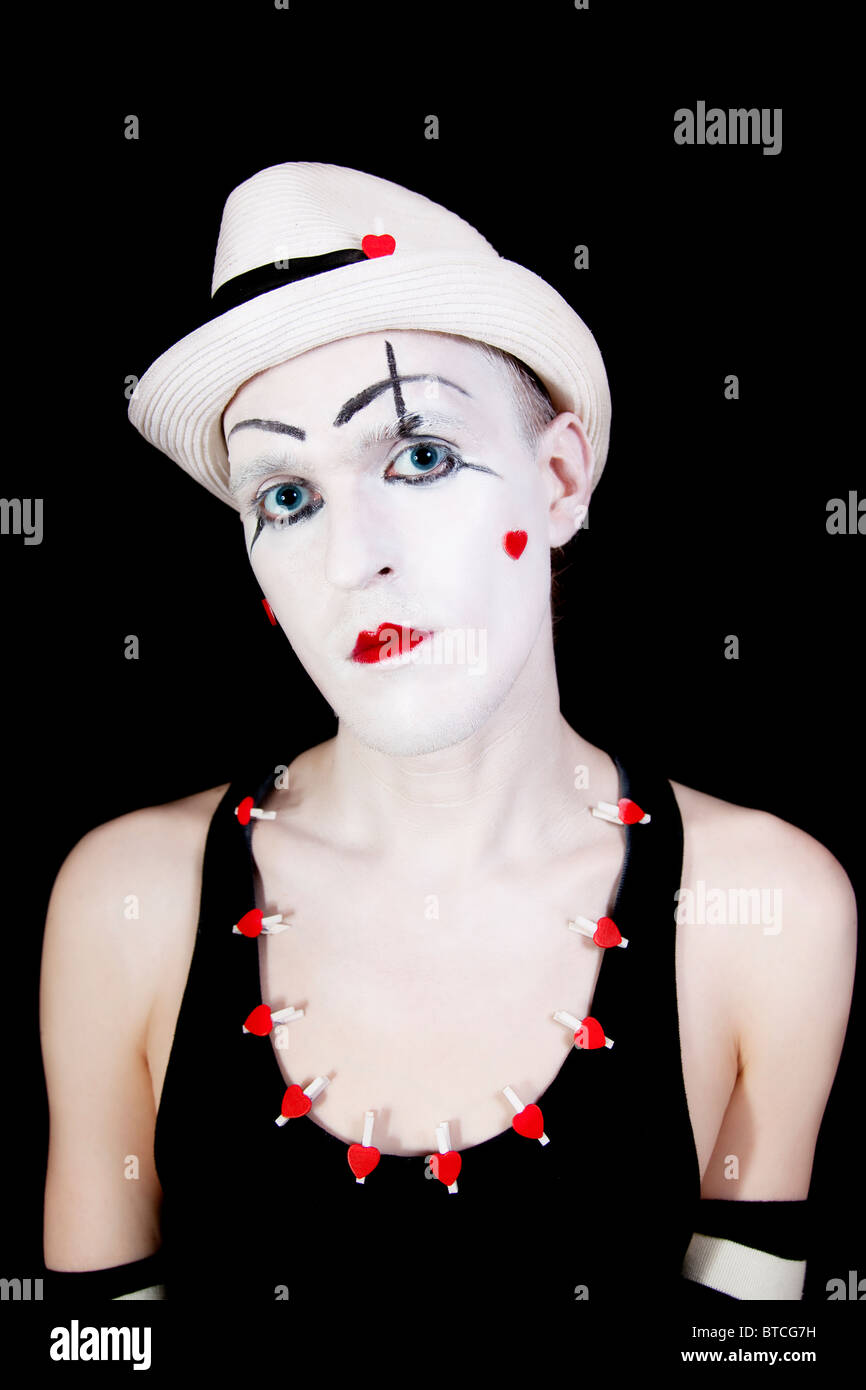 Pantomimes in white hat on black background Stock Photo - Alamy