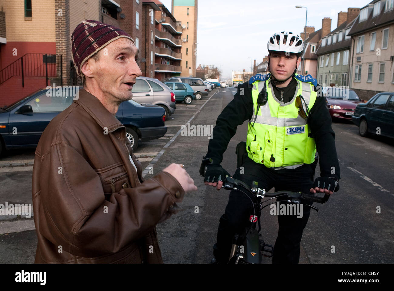 Police Community Support Officers chat with a local resident on a ...