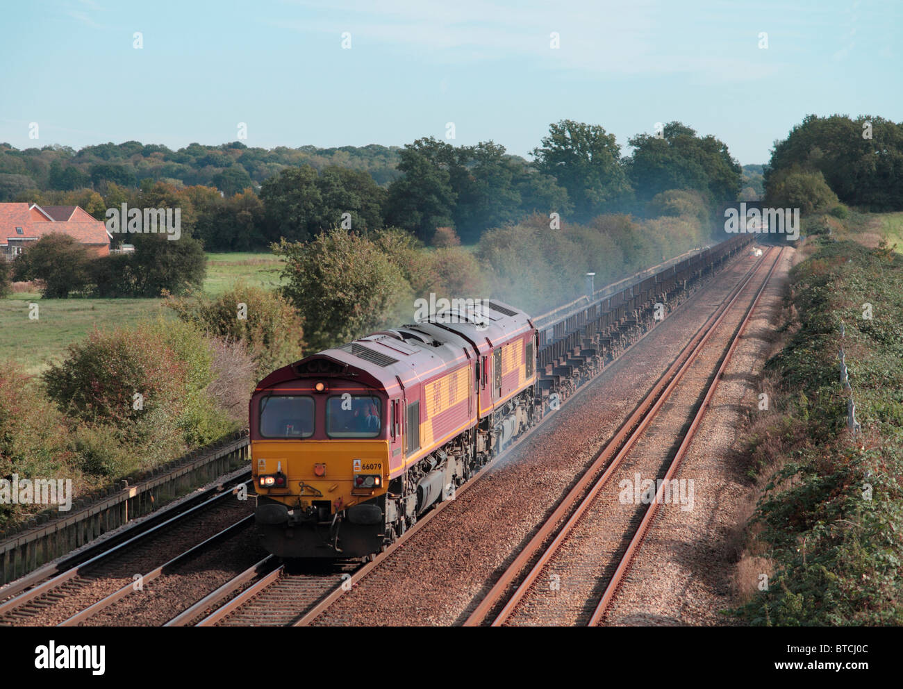 A pair of EWS class 66 locomotives working a train of empty steel ...