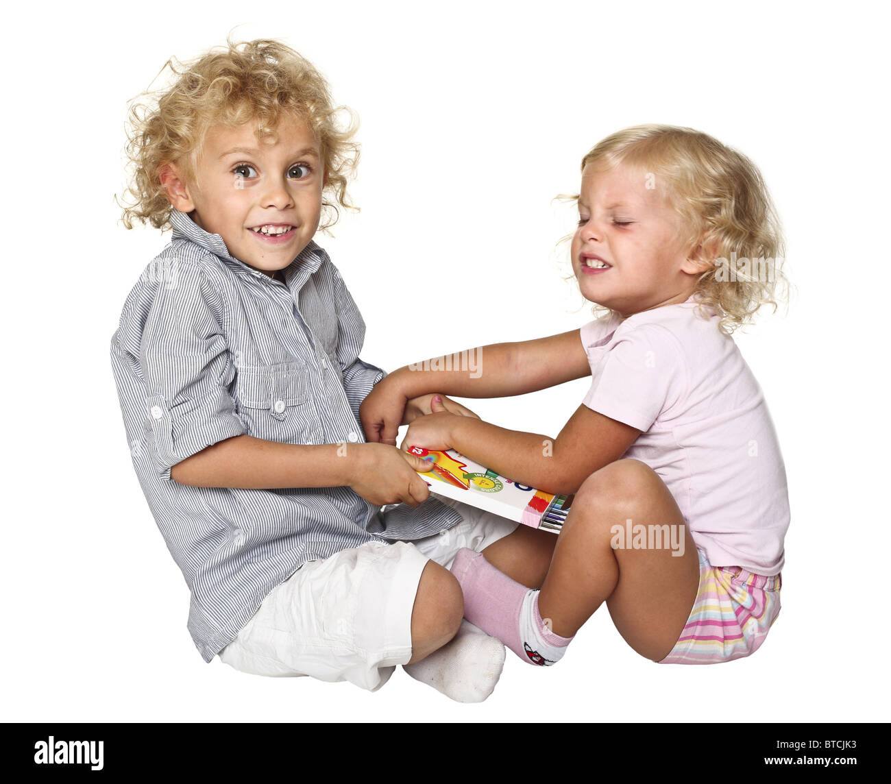 Siblings at play Cut Out Stock Images & Pictures - Alamy