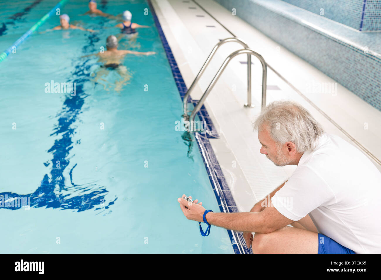 Swimming pool - swimmer training competition in class with coach Stock ...