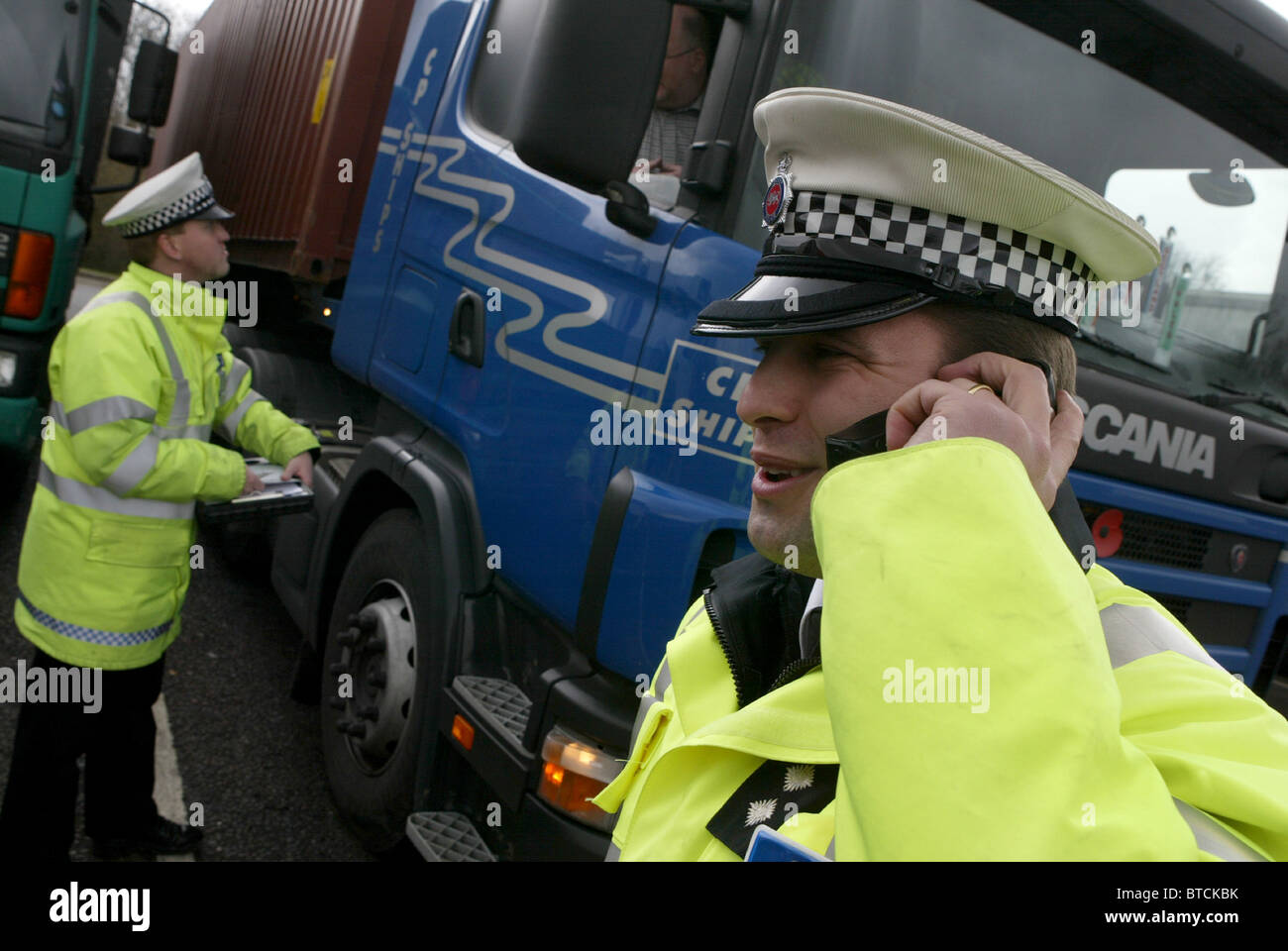 British traffic Police Officers checking on long-distance lorry drivers ...