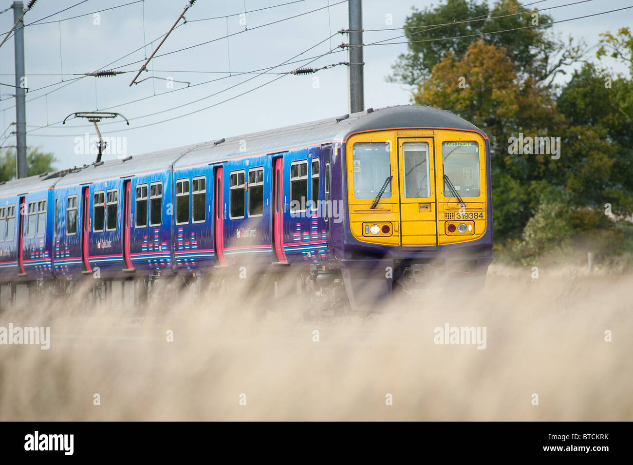 Passenger train in First Capital Connect livery speeding through the ...