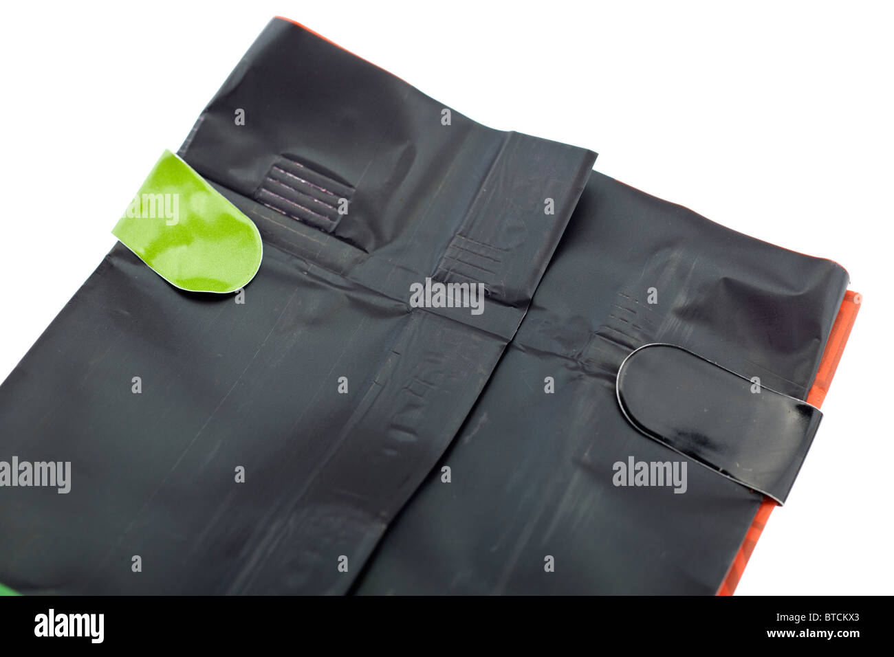 Two resealable tabs on a plastic packet Stock Photo - Alamy