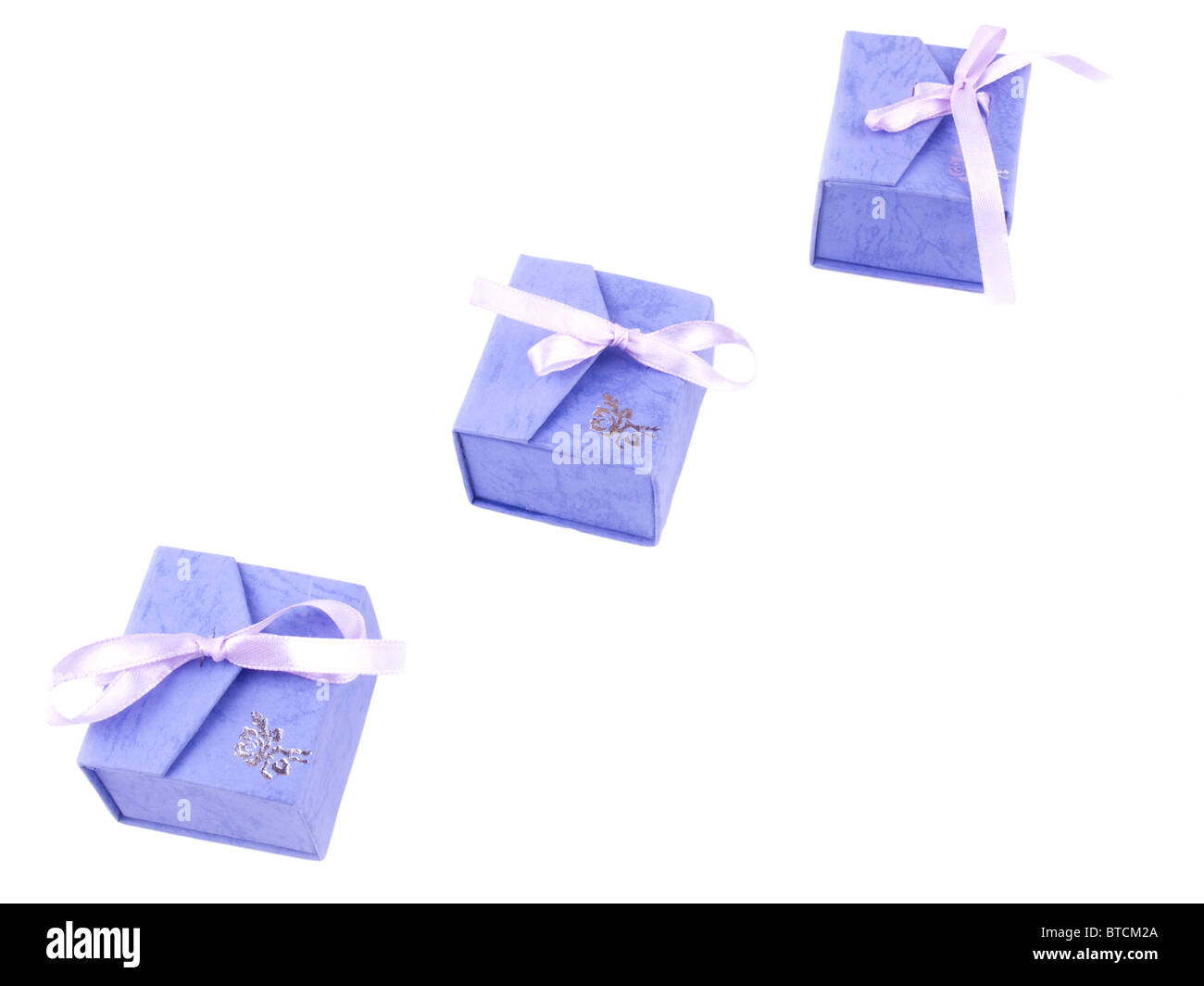 Three small lilac gift boxes isolated on white background Stock Photo ...