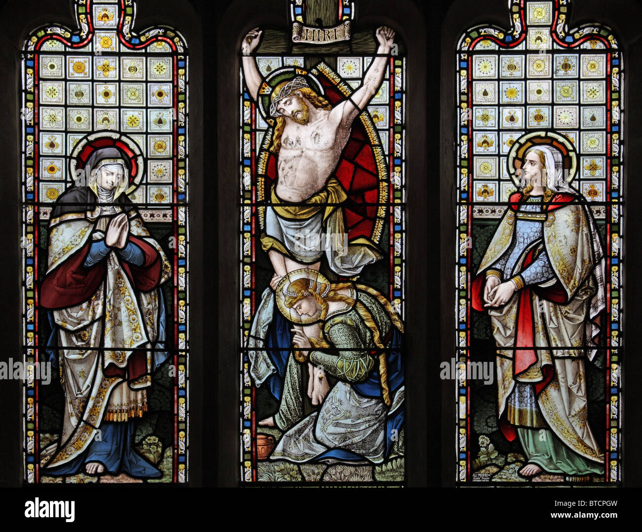 A stained glass window by A. L. Moore depicting the Crucifixion and the ...