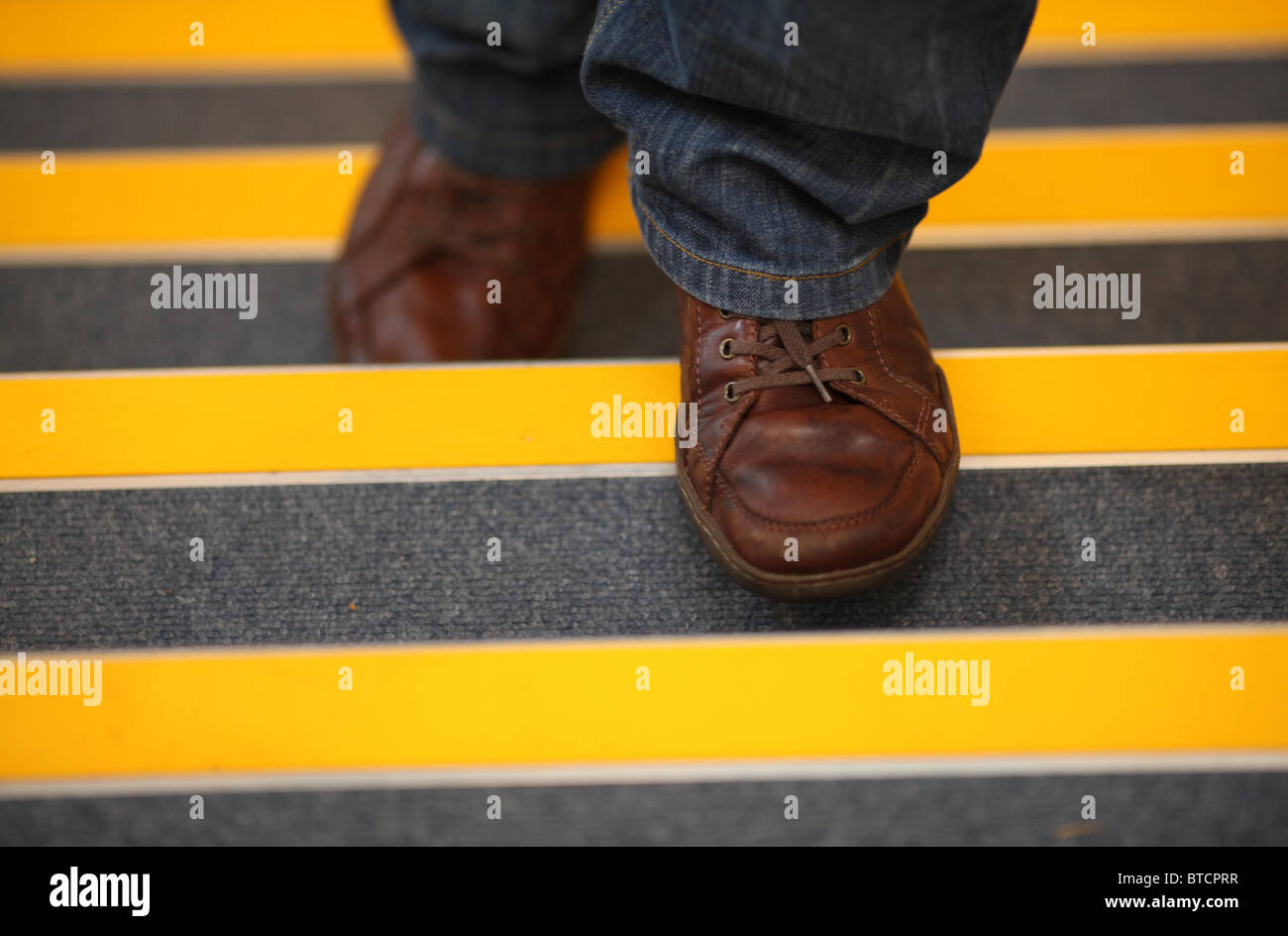 Feet on stairs. Picture by James Boardman Stock Photo - Alamy
