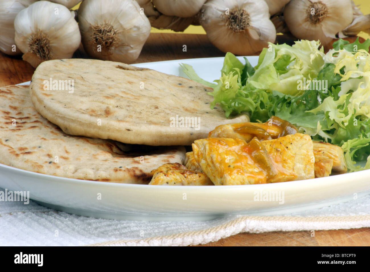 naan bread with turkey curry on a plate Stock Photo - Alamy