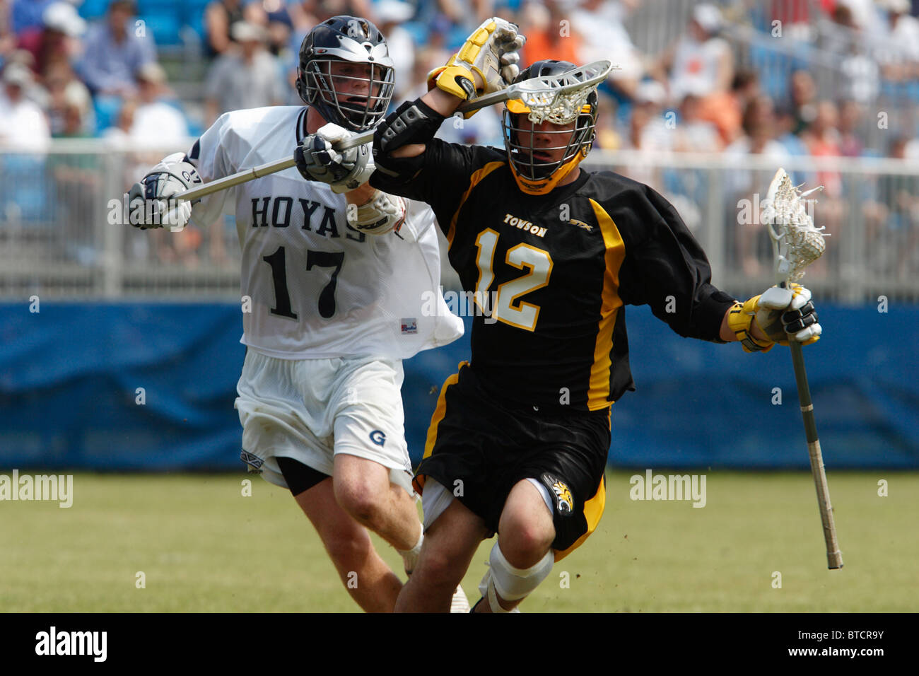 A Towson University player (r) attacks as a Georgetown University ...