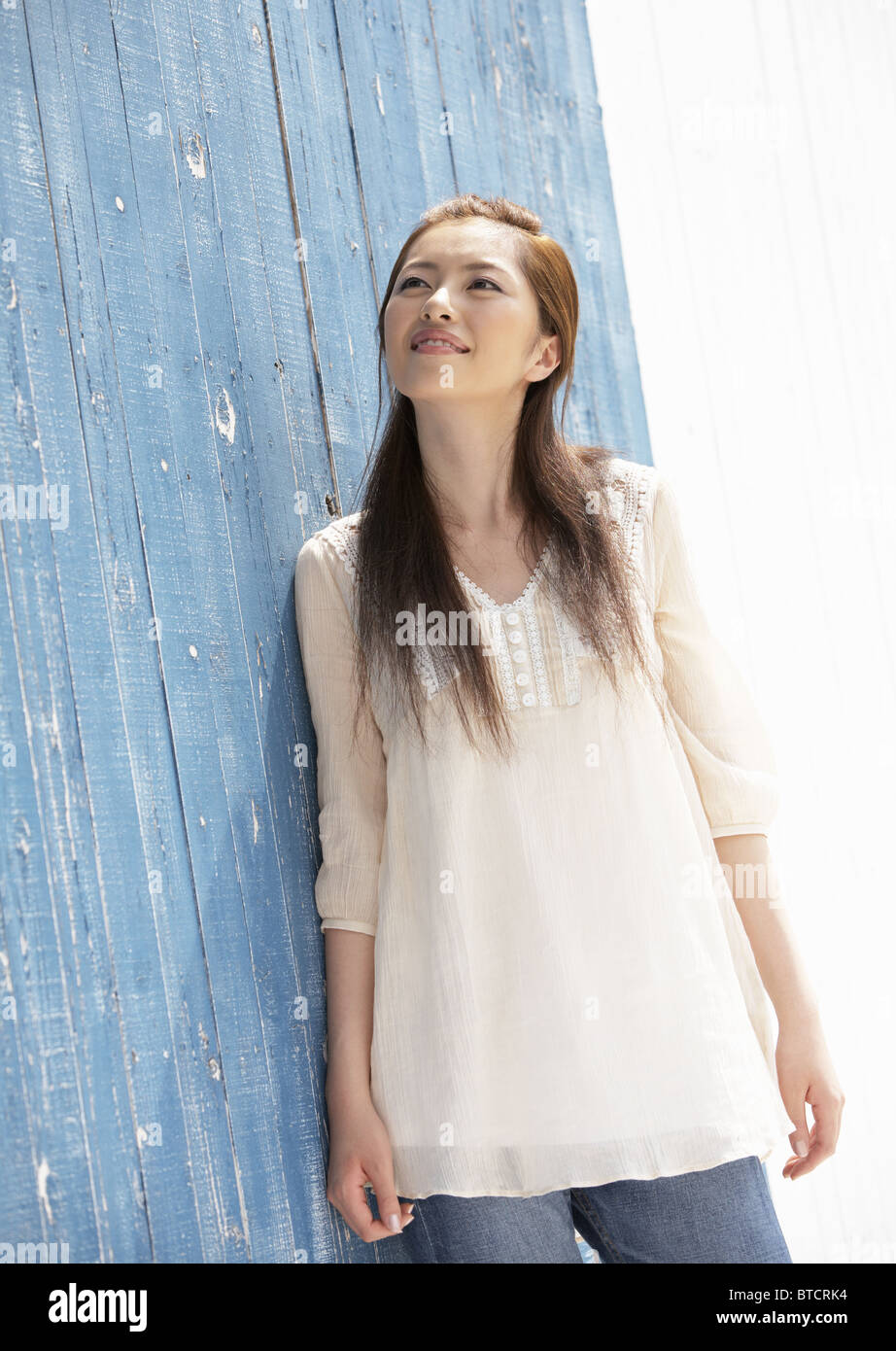 Woman looking up Stock Photo - Alamy