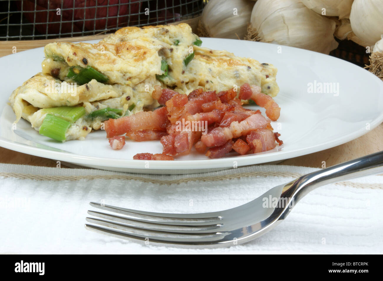 scrambled eggs with grilled bacon bits on a plate Stock Photo - Alamy