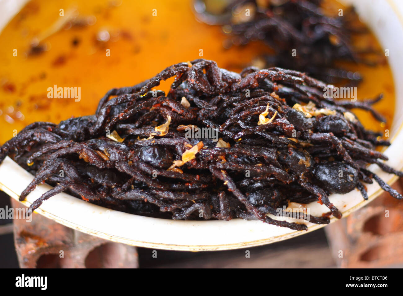 Plate of cooked spiders in Skuon city, Cambodia, 2010, Asia Stock Photo ...