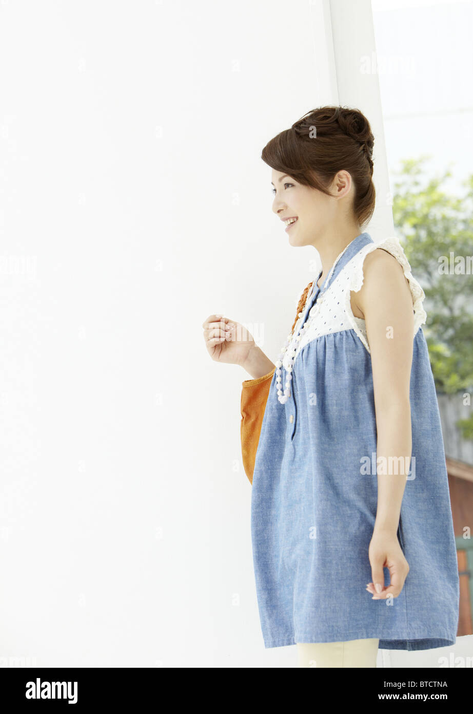 Woman going out Stock Photo - Alamy