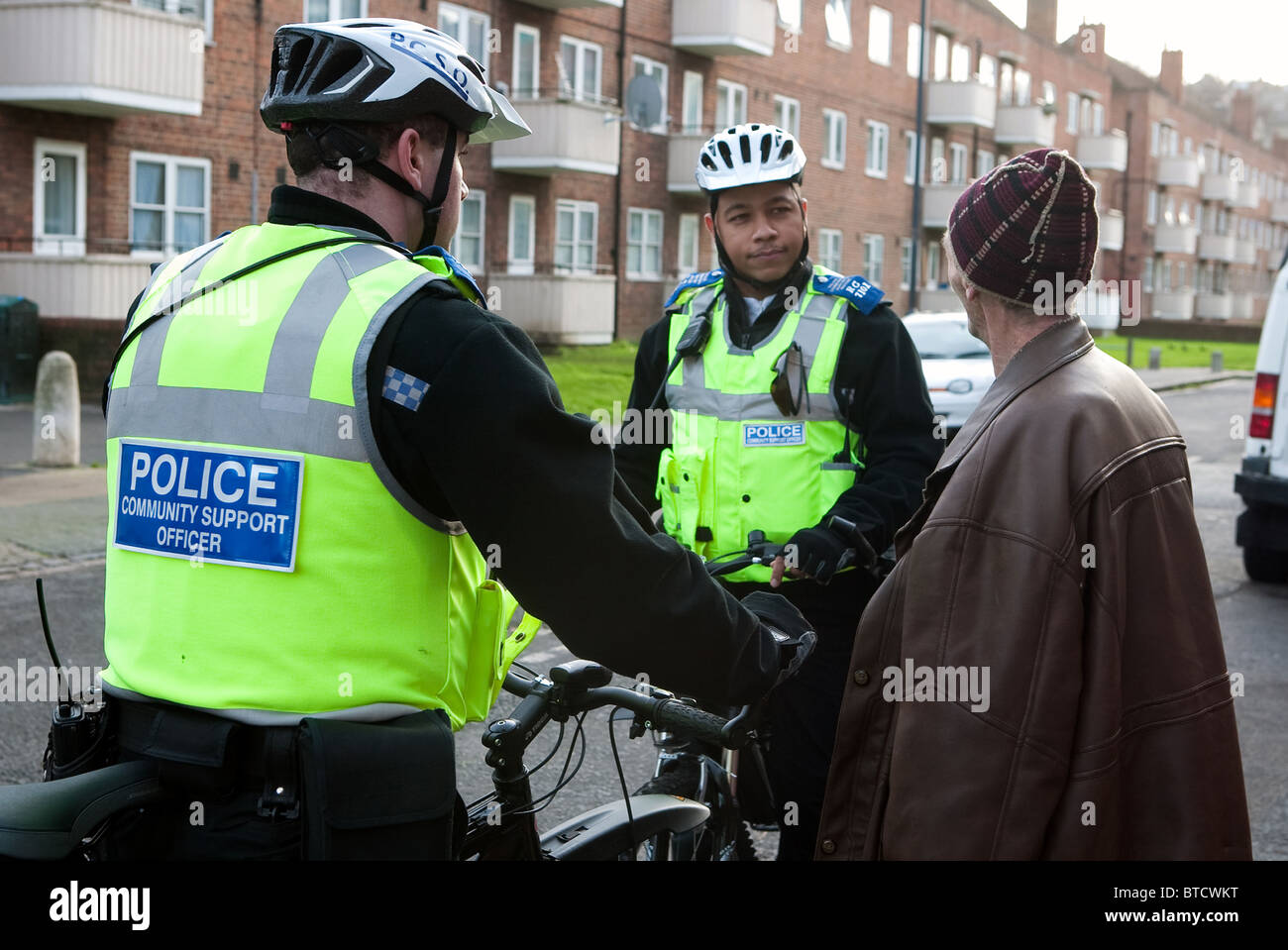 Police Community Support Officers chat with a local resident on a ...