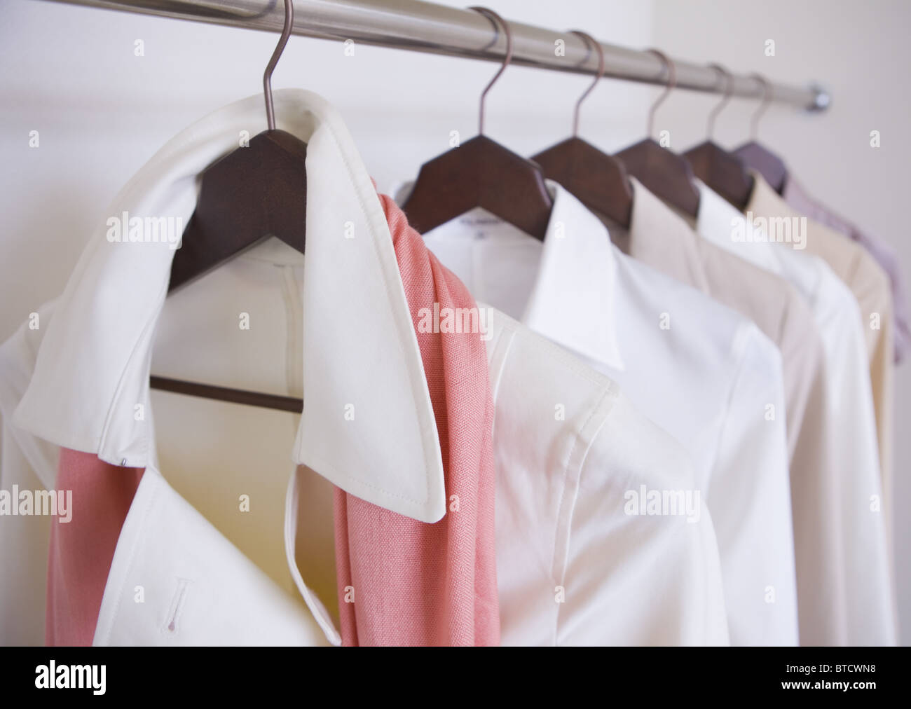 Clothes on hangers Stock Photo - Alamy