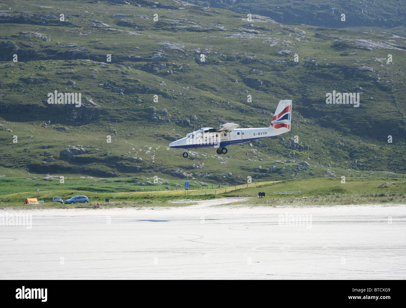 propeller plane landing on beach runway Barra airport Isle of Barra ...