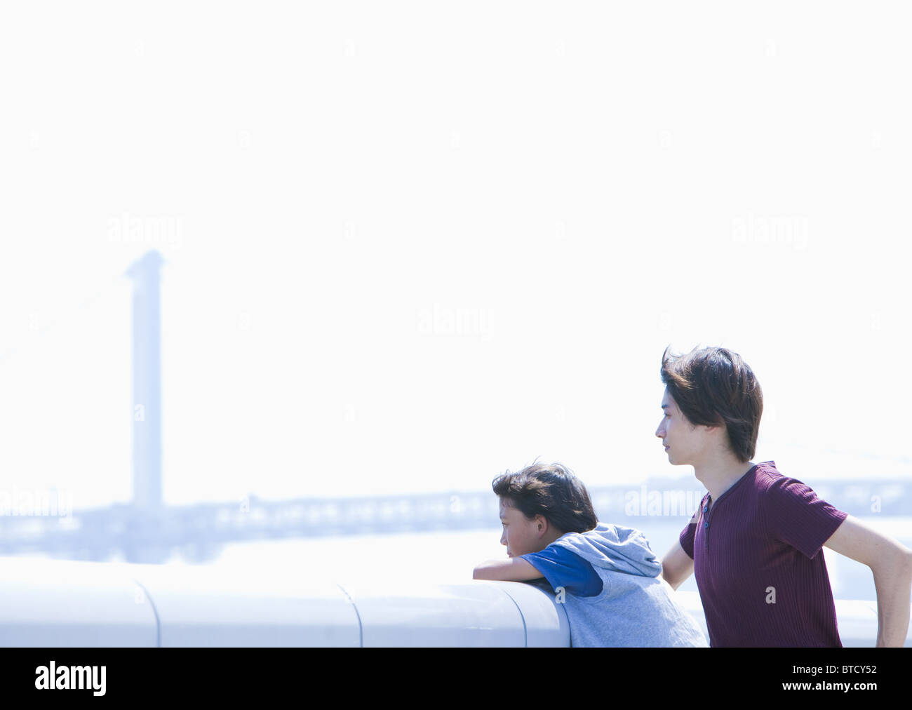Father and son looking away Stock Photo - Alamy
