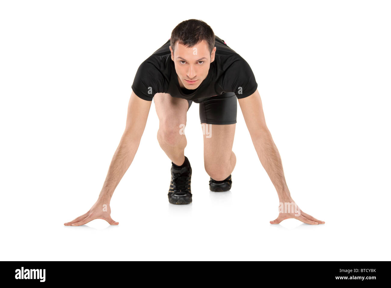 Full length portrait of a male athlete ready to run Stock Photo - Alamy