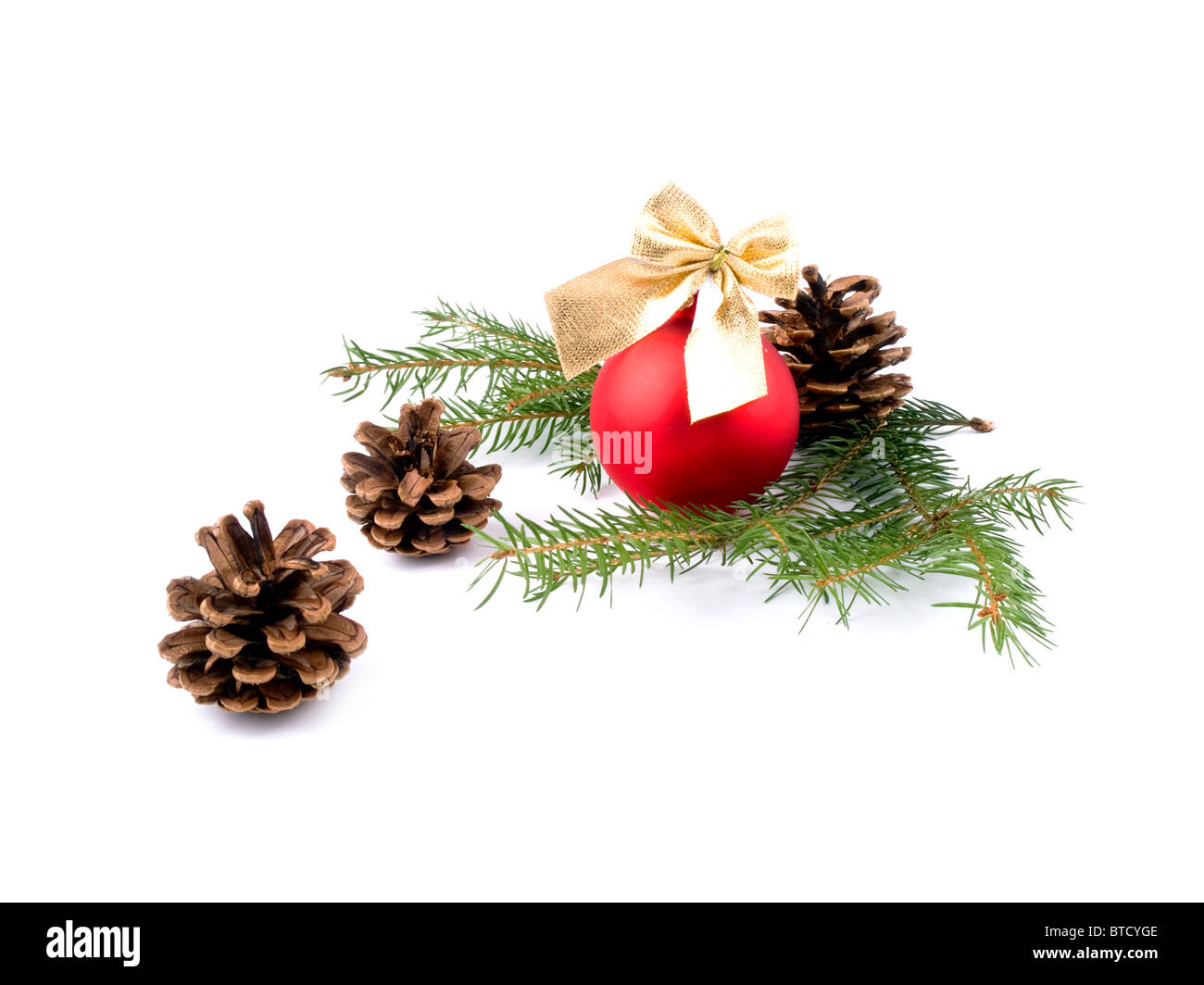 Three cones and red glass ball on white background Stock Photo - Alamy