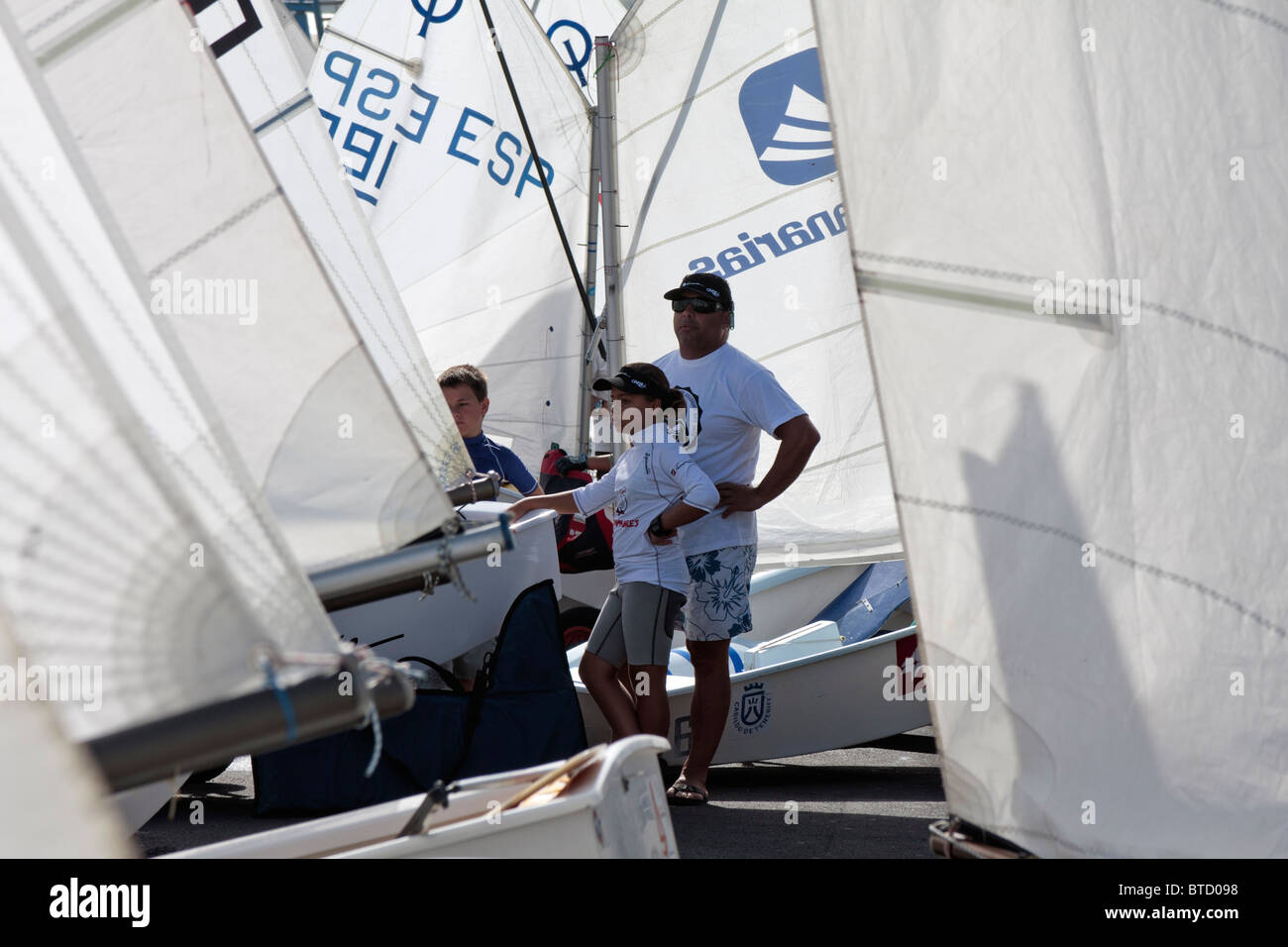 Getting ready to take part in a regatta of Optimist sailing dinghies in ...