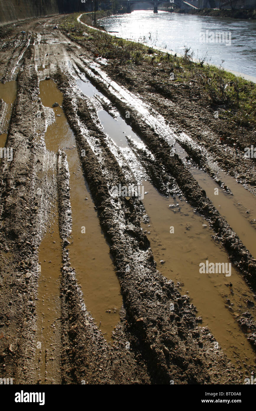 many tyre tracks crossing in mud in field in countryside Stock Photo ...