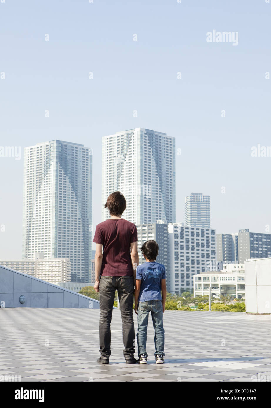 Father and son standing Stock Photo - Alamy