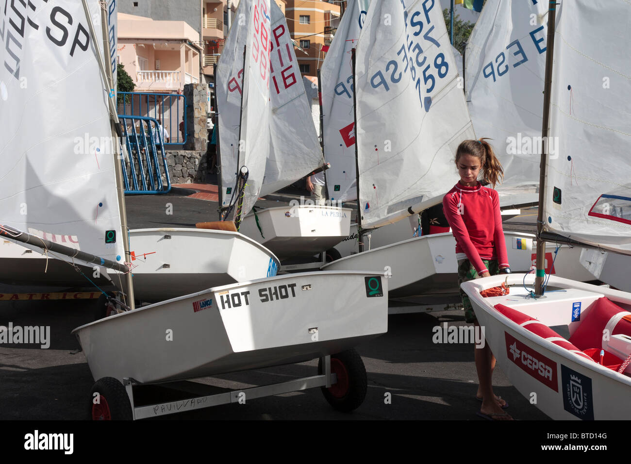 Getting ready to take part in a regatta of Optimist sailing dinghies in ...