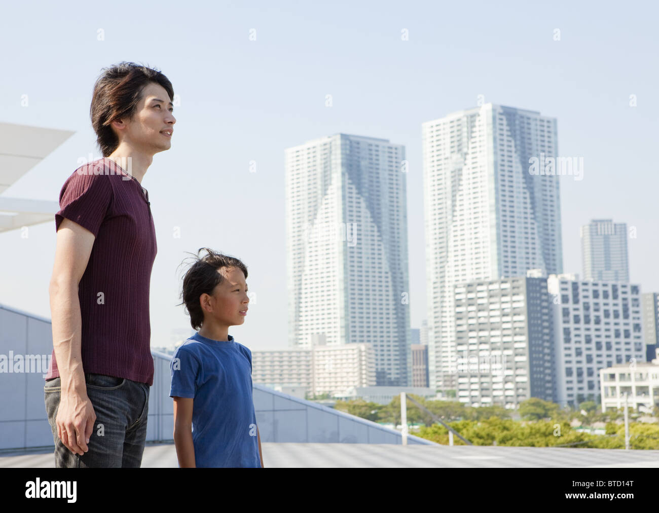 Father and son looking away Stock Photo - Alamy