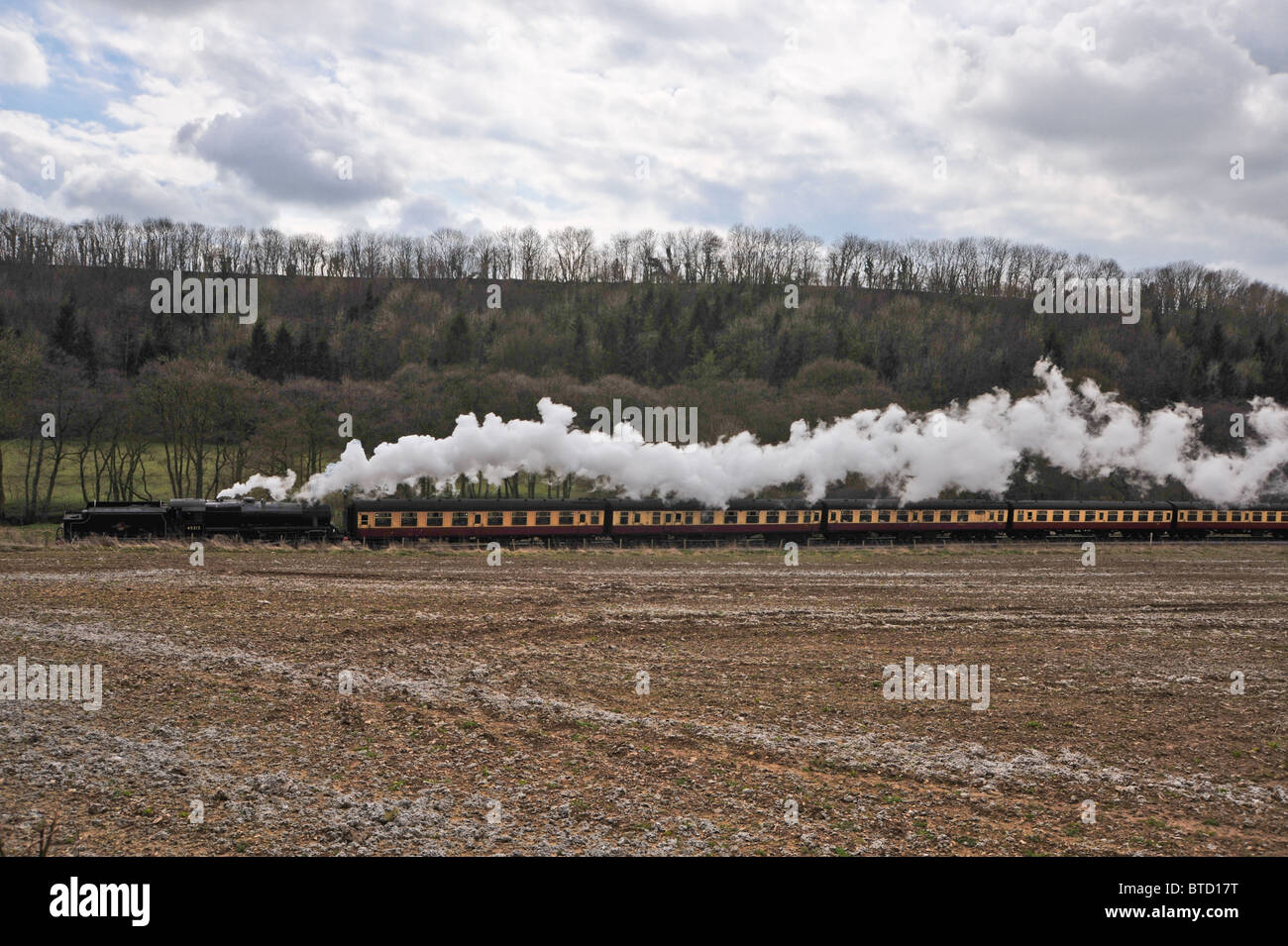 Steam train trailing smoke in Yorkshire Stock Photo - Alamy