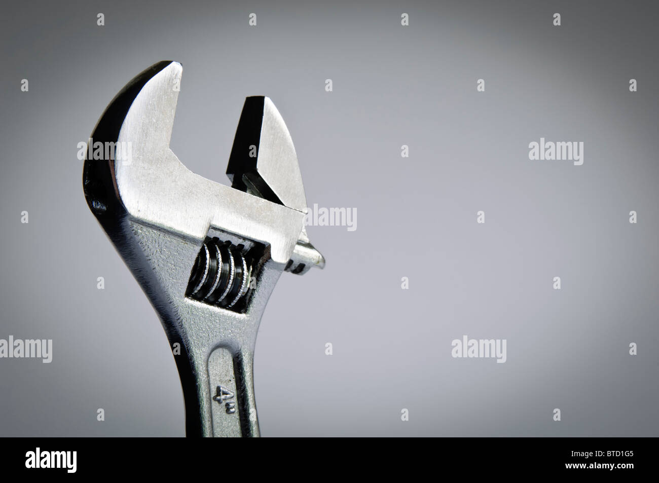 Spanner / wrench head against a grey background with copy space Stock ...