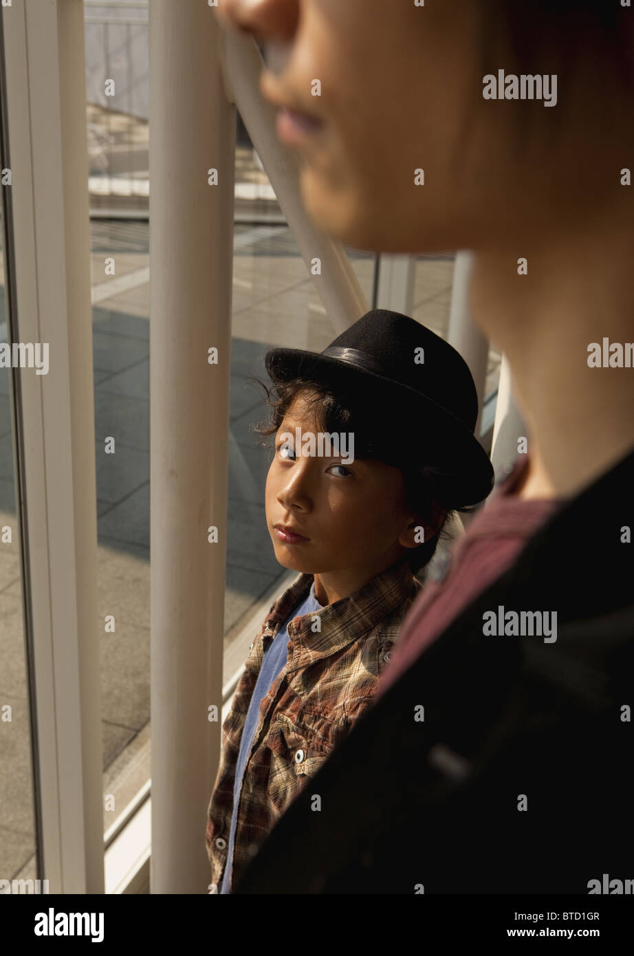 Boy staring at father Stock Photo - Alamy