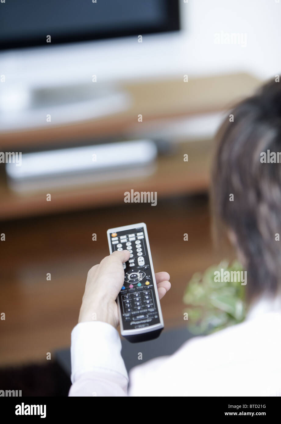 Close up of mans hand using remote control Stock Photo - Alamy