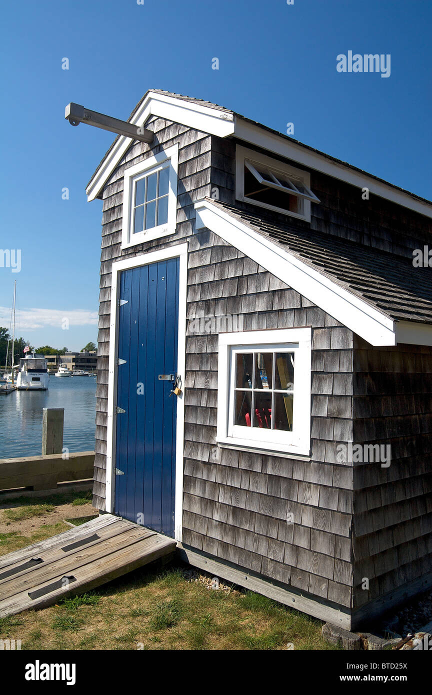 A small shingled storage building on the water Stock Photo - Alamy