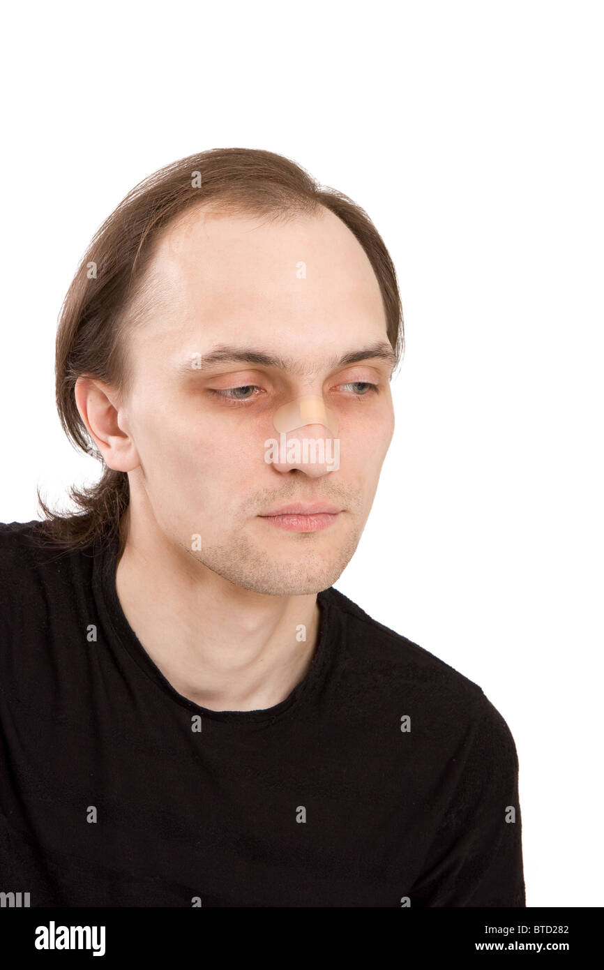 The man with a nose stuck with a plaster Stock Photo - Alamy