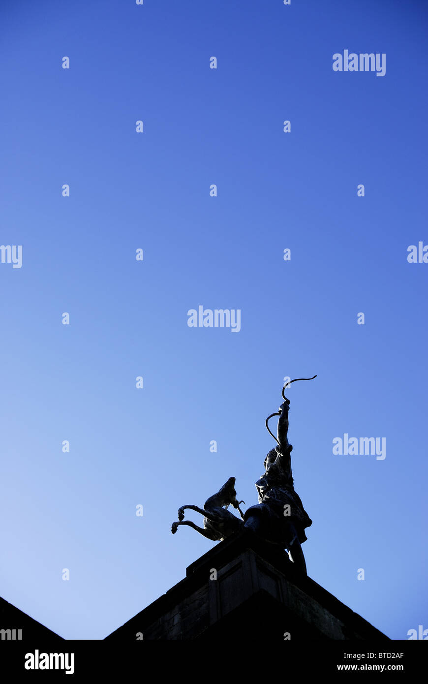 An stone carving of an archer catching a stag Stock Photo - Alamy