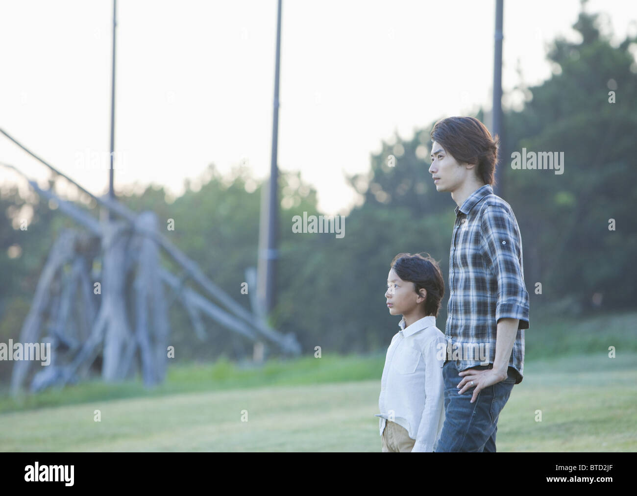 Father and son standing Stock Photo - Alamy