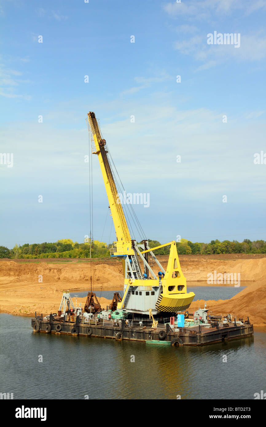floating excavator - development sandpit with dredge Stock Photo - Alamy